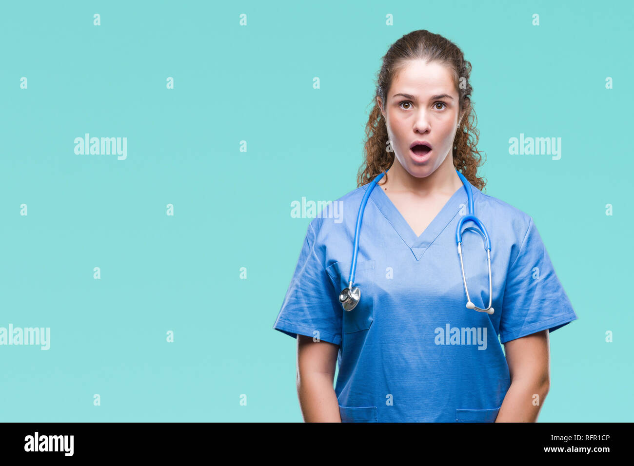 Young brunette doctor girl wearing nurse or surgeon uniform over ...