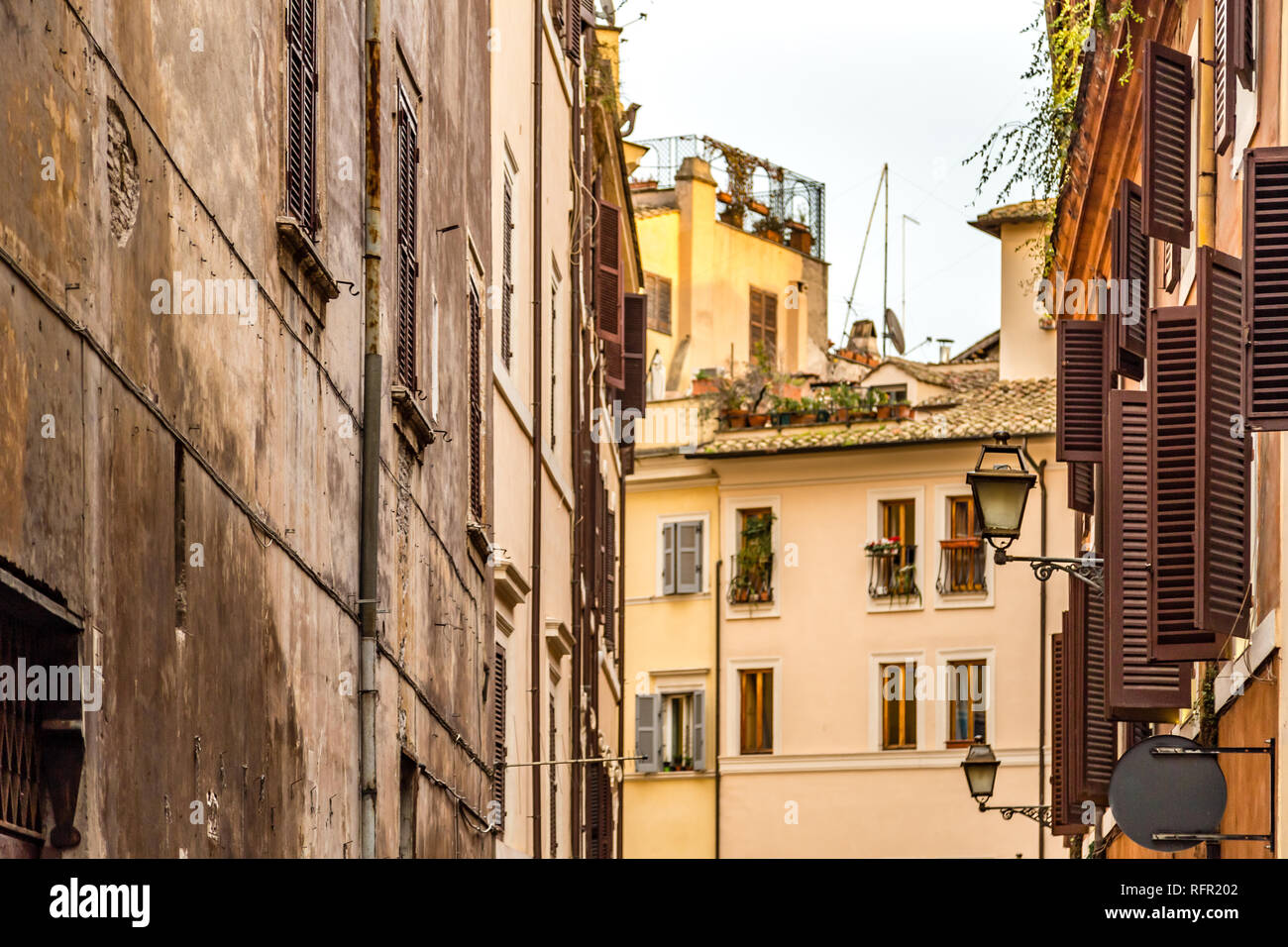typical ancient buildings in fascinating street of Rome Stock Photo - Alamy