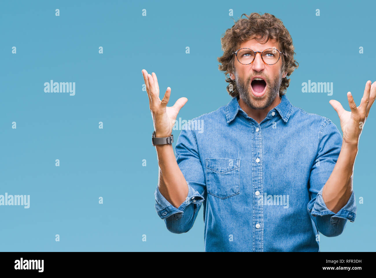 Handsome hispanic model man wearing glasses over isolated background ...