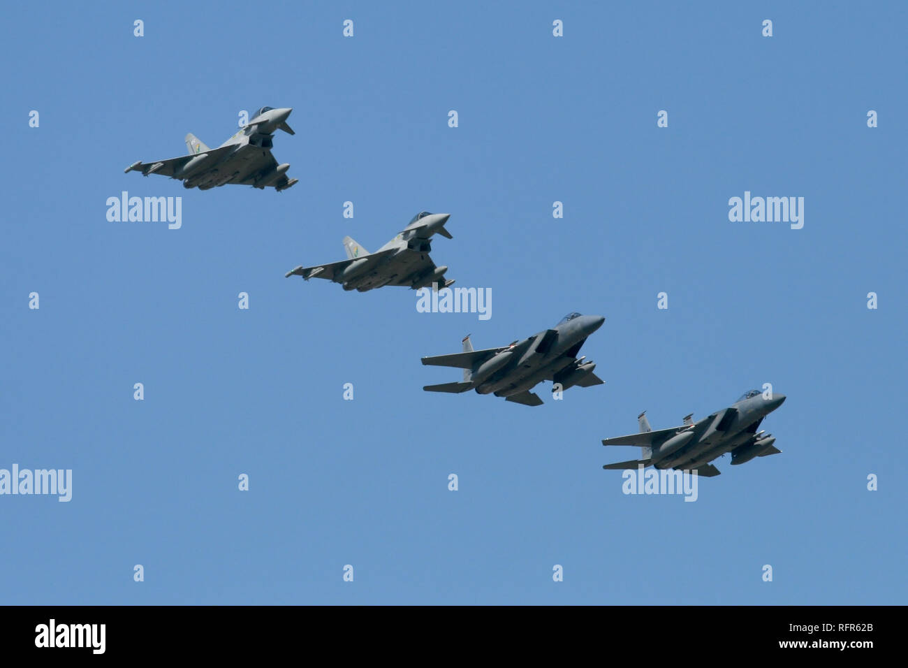 A mixed formation of RAF Typhoon FGR4s and USAF F-15C's recover back to ...