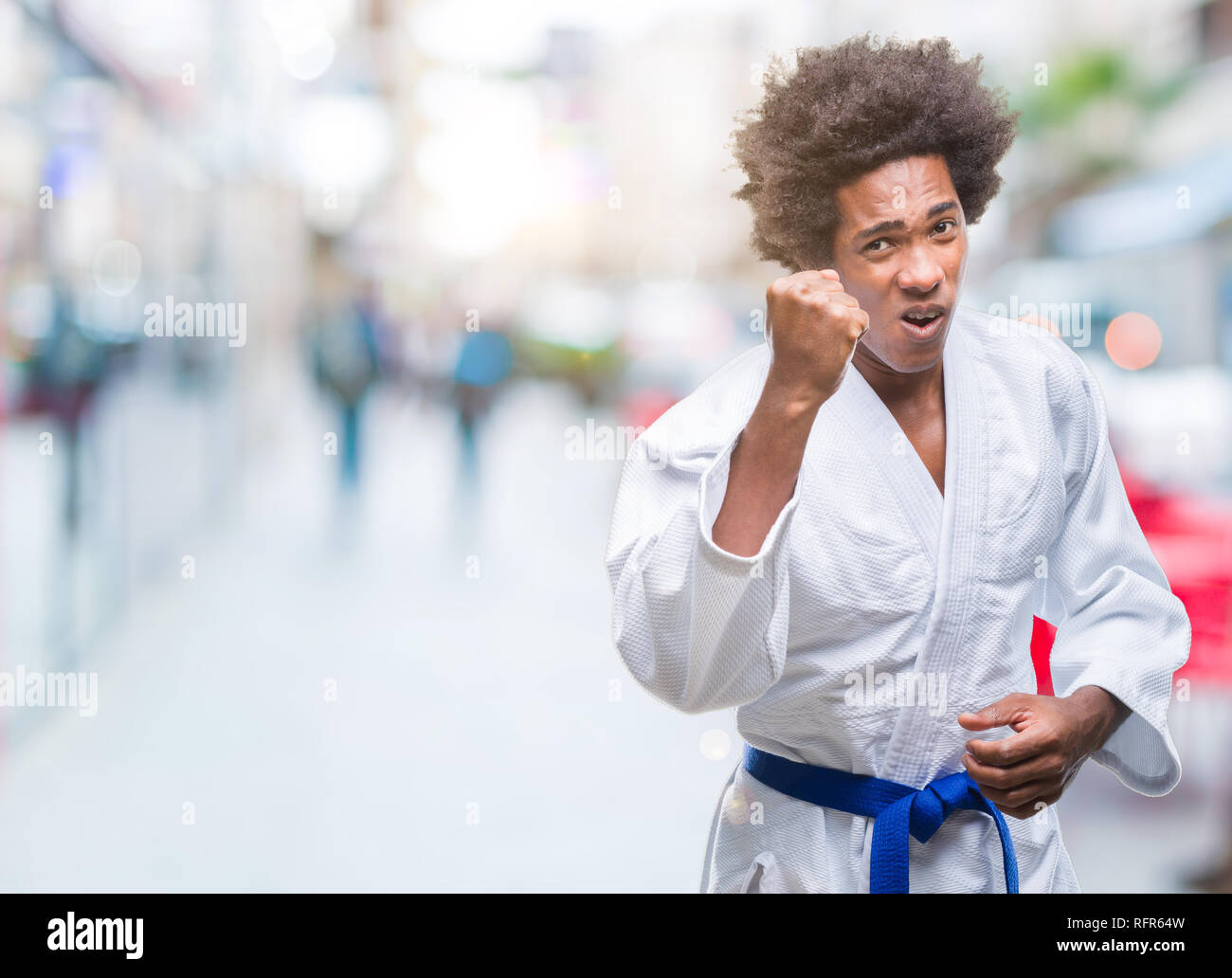 Afro american man wearing karate kimono over isolated background angry ...