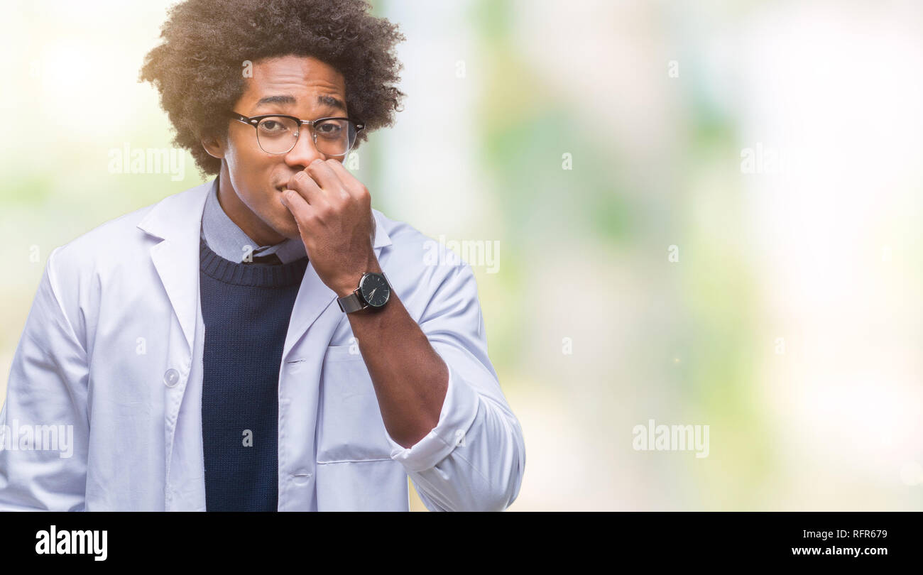 Afro american doctor scientist man over isolated background looking ...