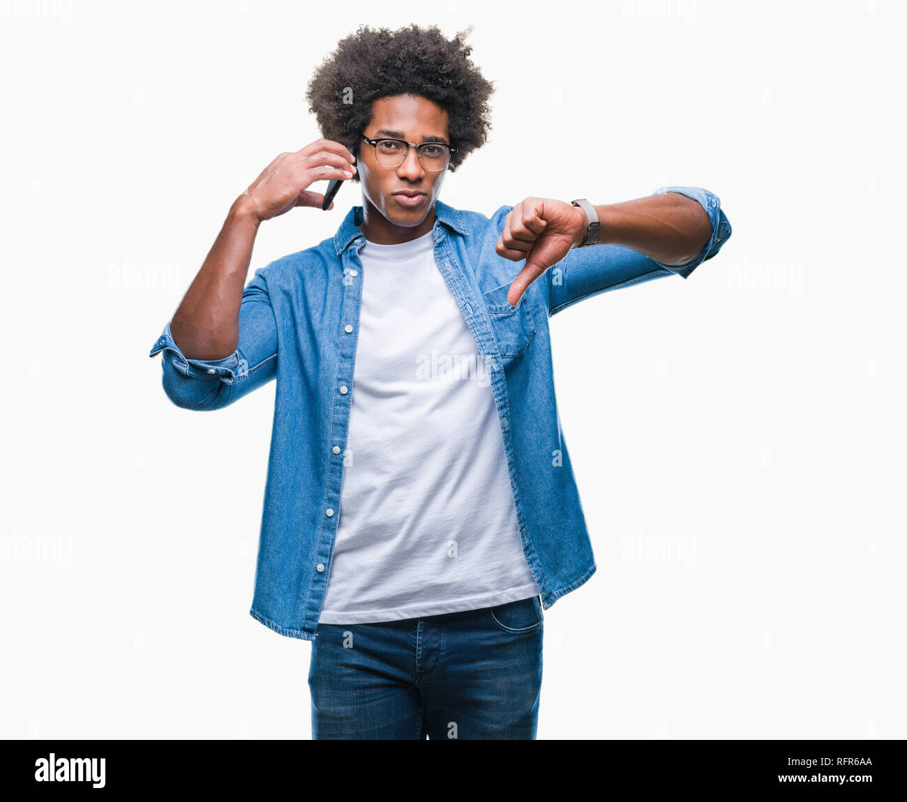 Afro american man talking on the phone over isolated background with ...