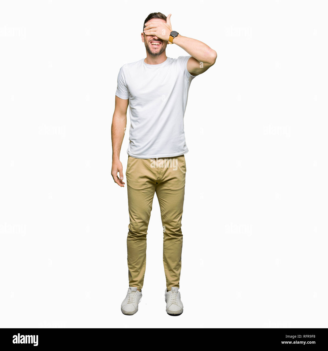 Handsome man wearing casual white t-shirt smiling and laughing with ...