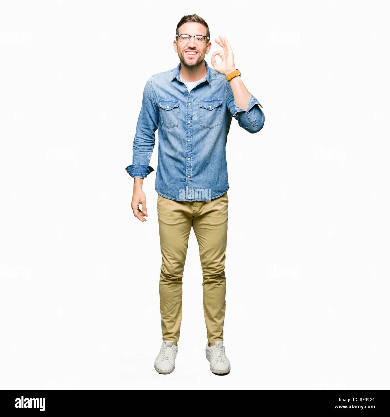 Handsome man wearing glasses smiling positive doing ok sign with hand ...