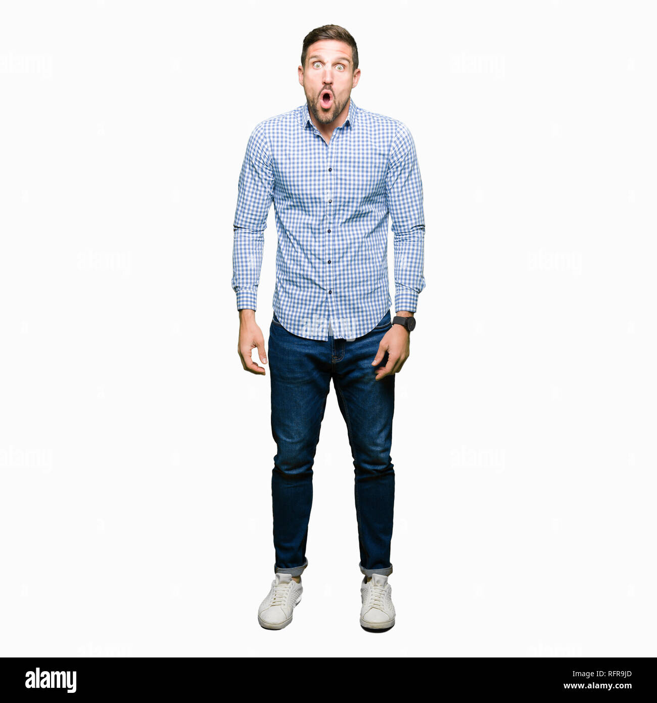 Handsome business man with blue eyes afraid and shocked with surprise ...