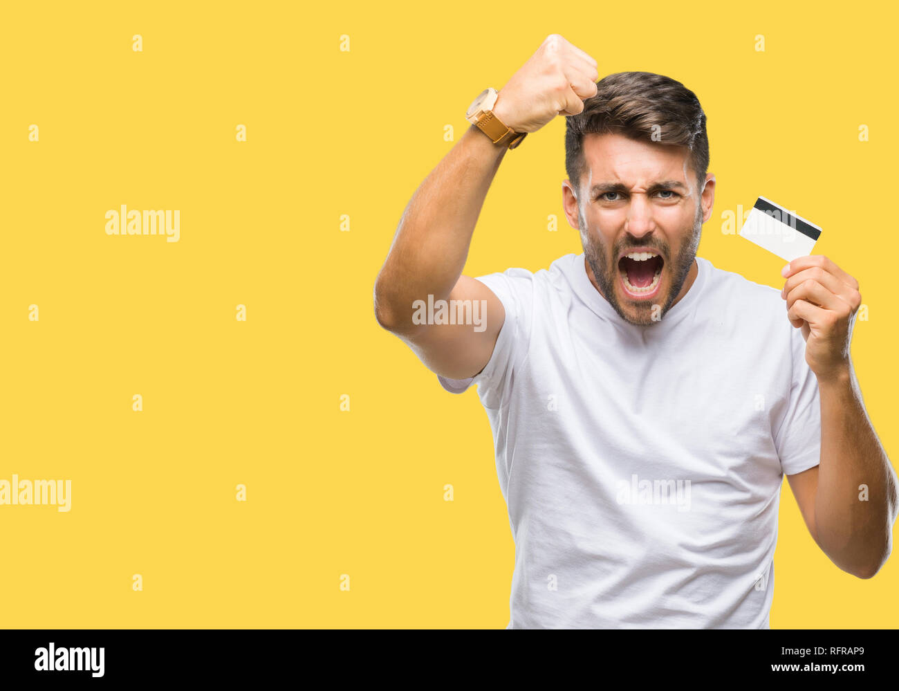 Young handsome man holding credit card over isolated background annoyed ...