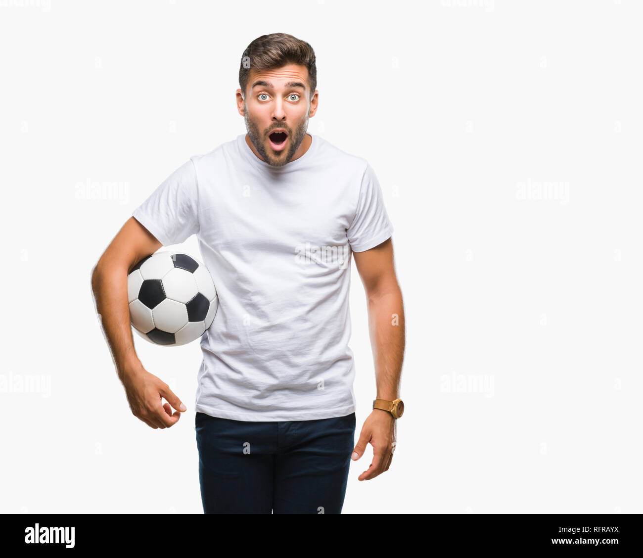 Young handsome man holding soccer football ball over isolated ...