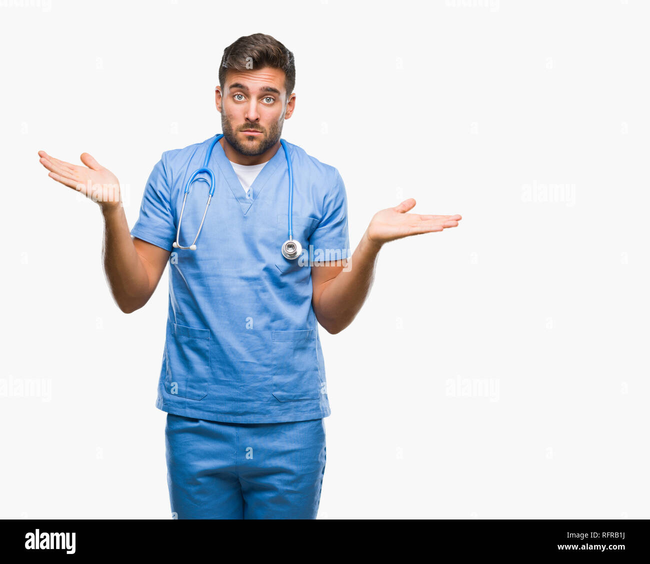 Young handsome doctor surgeon man over isolated background clueless and ...
