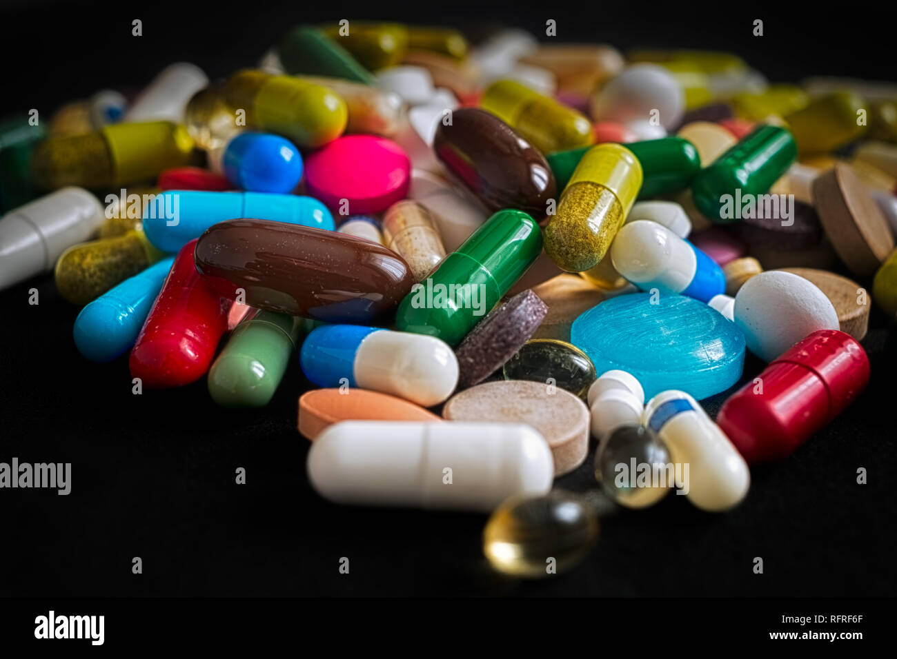 Pharmaceutical tablets, capsules, therapy drugs and pills on black ...