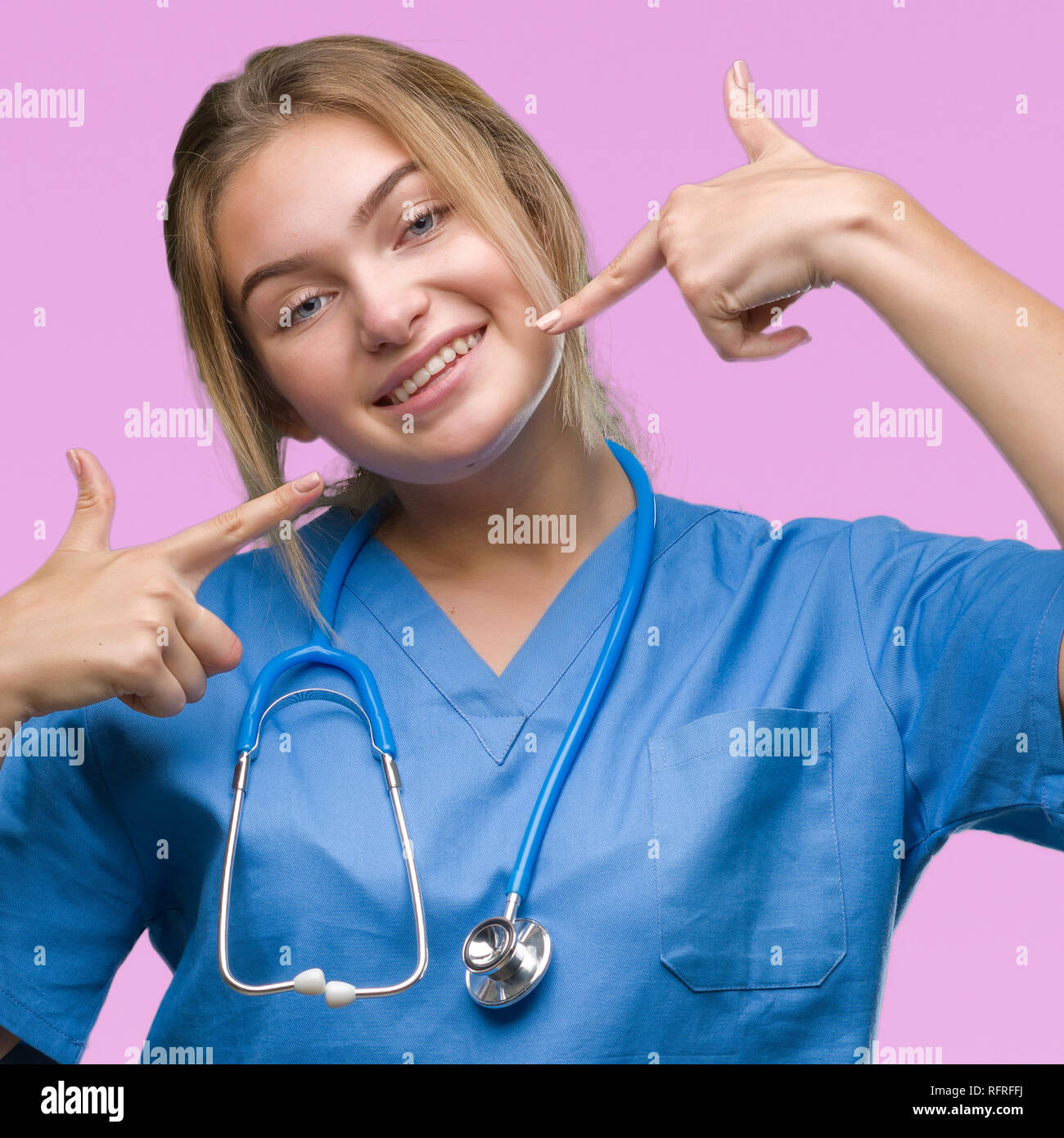 Young caucasian doctor woman wearing surgeon uniform over isolated ...