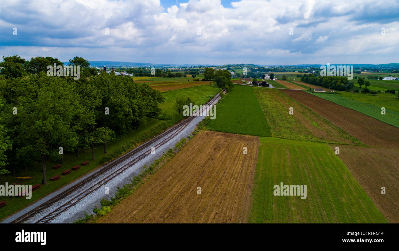Ariel View Waiting for Steam Train with Passenger Cars on a Sunny ...