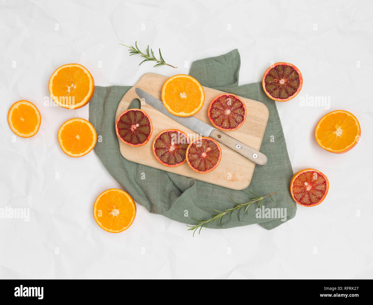 beautiful still life with blood oranges on white paper background and ...