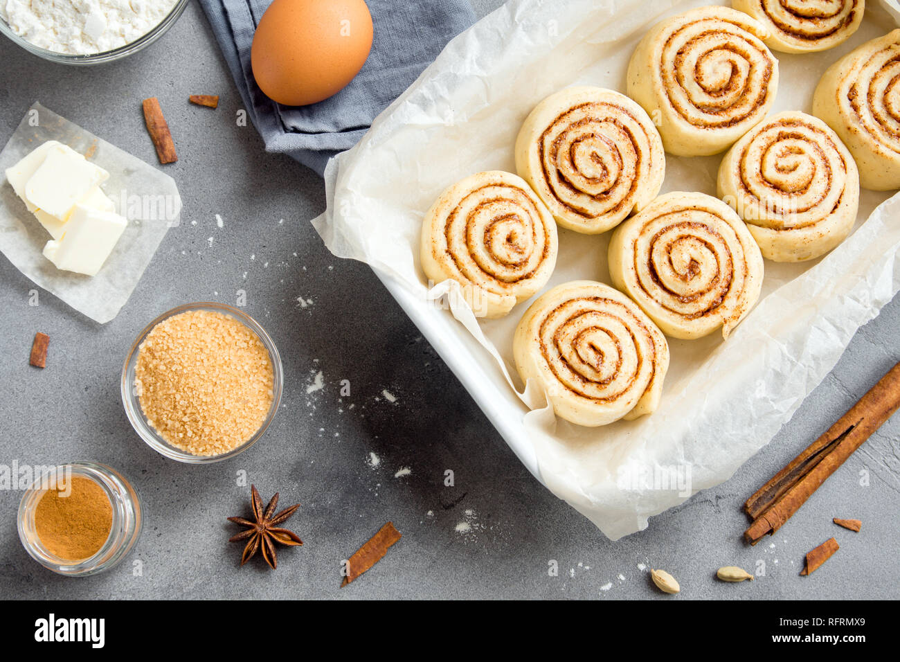 Cinnamon rolls or cinnabon, homemade recipe raw dough preparation sweet ...