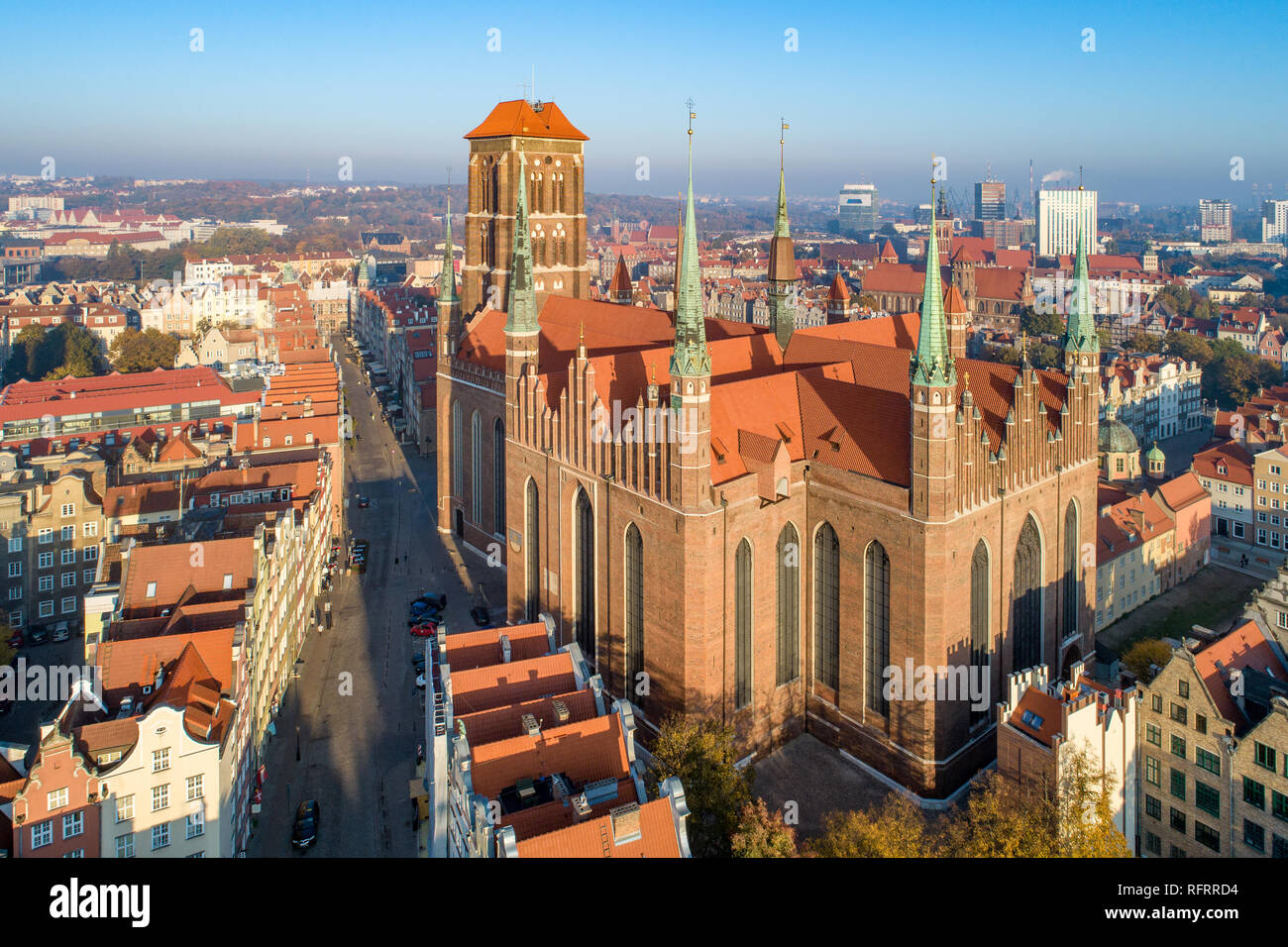 Medieval Gothic Saint Mary Cathedral and Gdansk old city in Poland. Aerial view in sunrise light ...