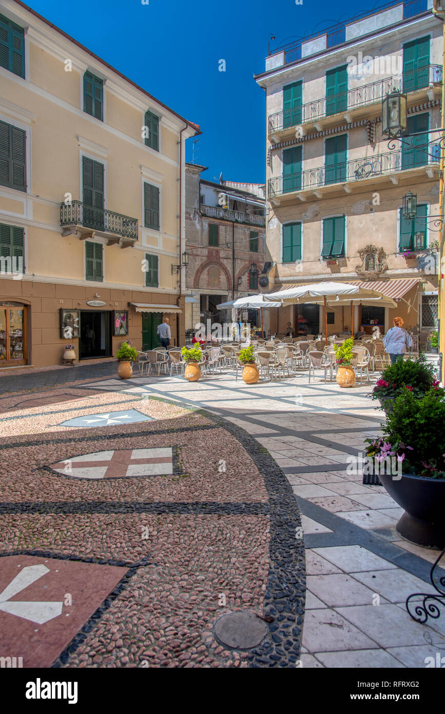 Picturesque urban square in Noli, Italy with curving decorative paving ...