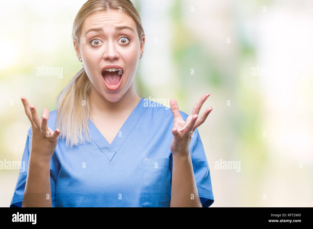 Young blonde surgeon doctor woman wearing medical uniform over isolated ...