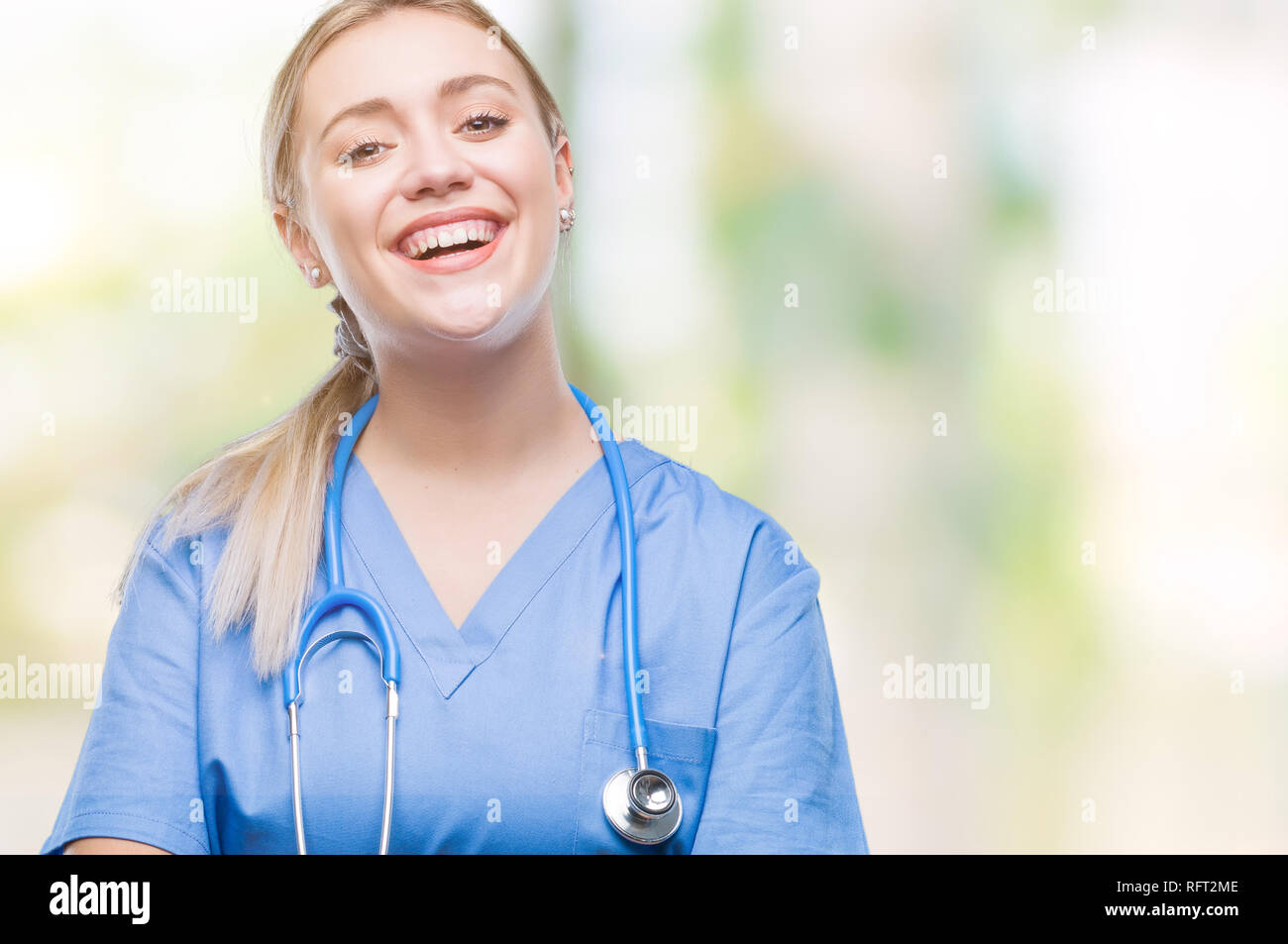 Young blonde surgeon doctor woman over isolated background happy face ...