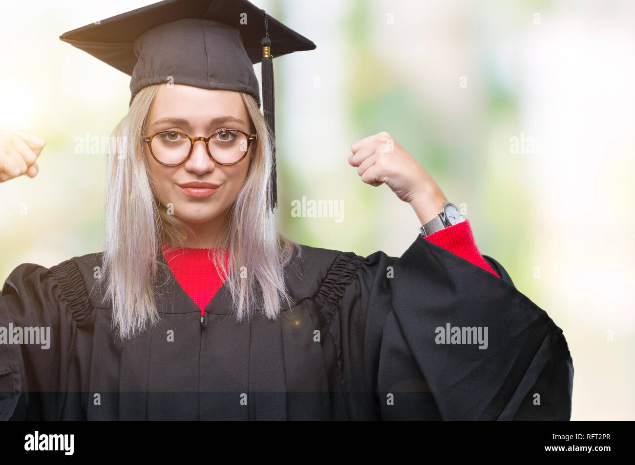 Young blonde woman wearing graduate uniform over isolated background ...