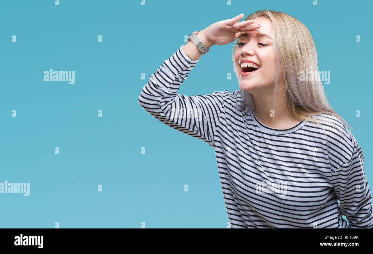 Young blonde woman over isolated background very happy and smiling ...