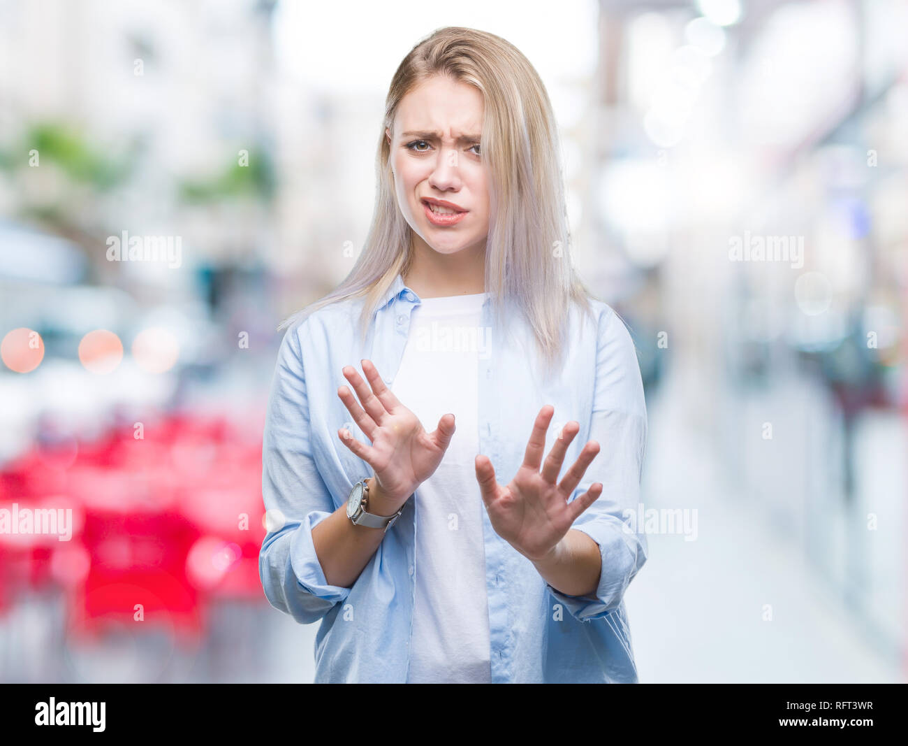 Young blonde woman over isolated background disgusted expression ...