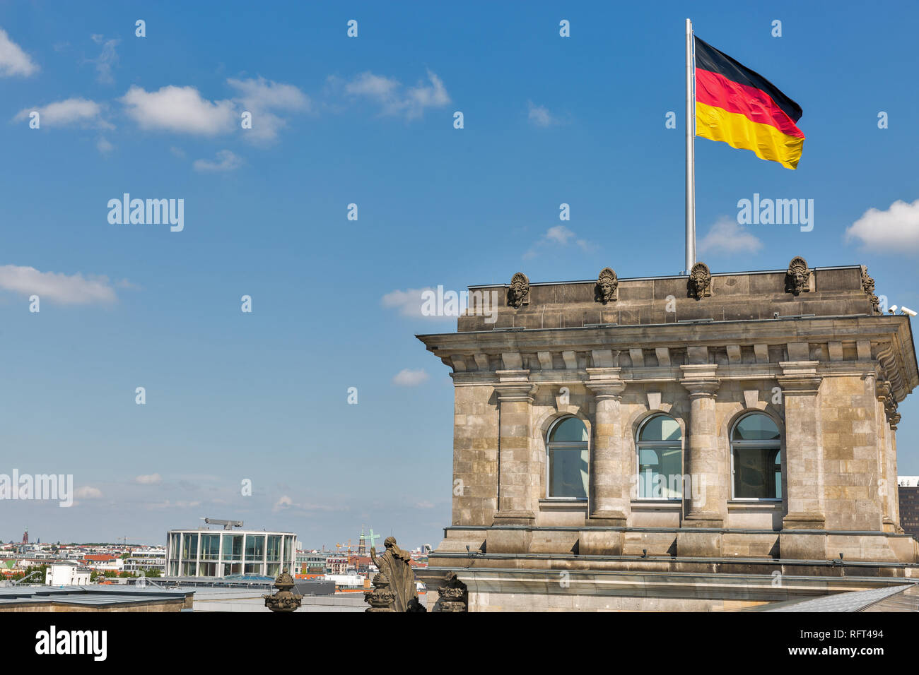 Closeup view of famous Reichstag building tower and German flag with ...