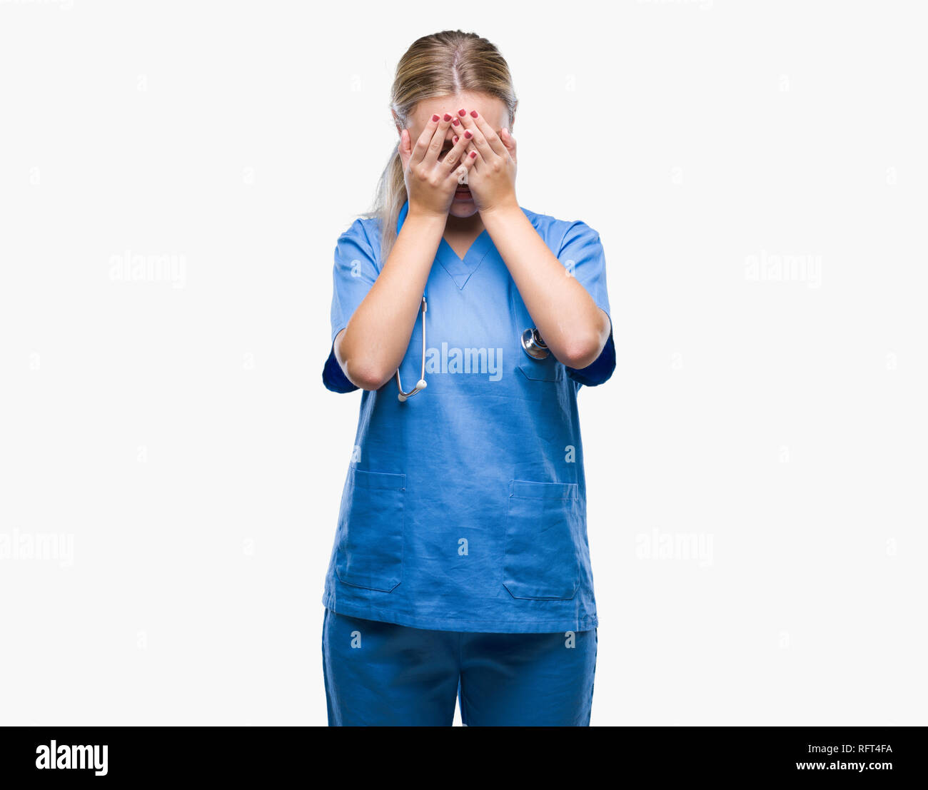 Young blonde surgeon doctor woman over isolated background with sad ...