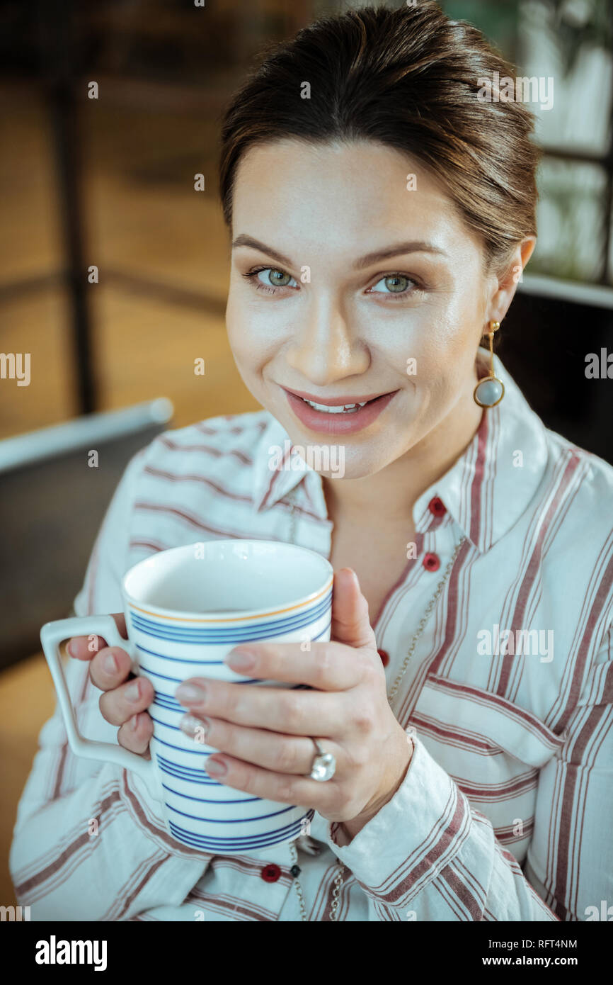 Beautiful young woman enjoying tea hi-res stock photography and images ...