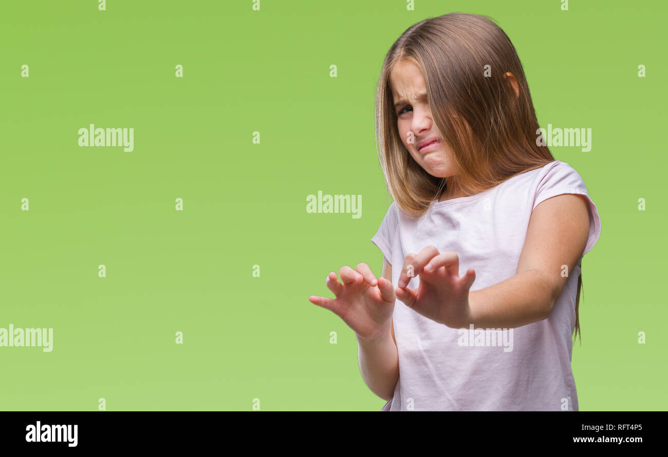 Young beautiful girl over isolated background disgusted expression ...