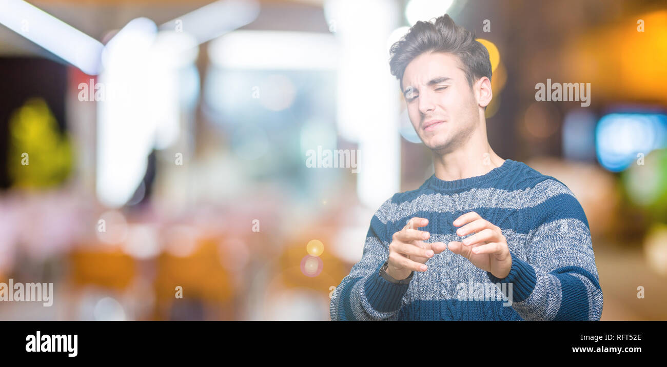 Young handsome man over isolated background disgusted expression ...