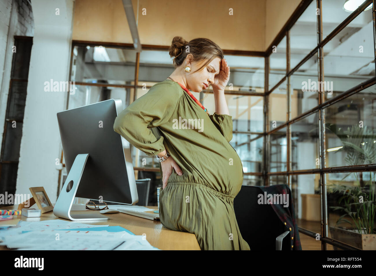 Woman with nice hairstyle touching her forehead having headache Stock ...
