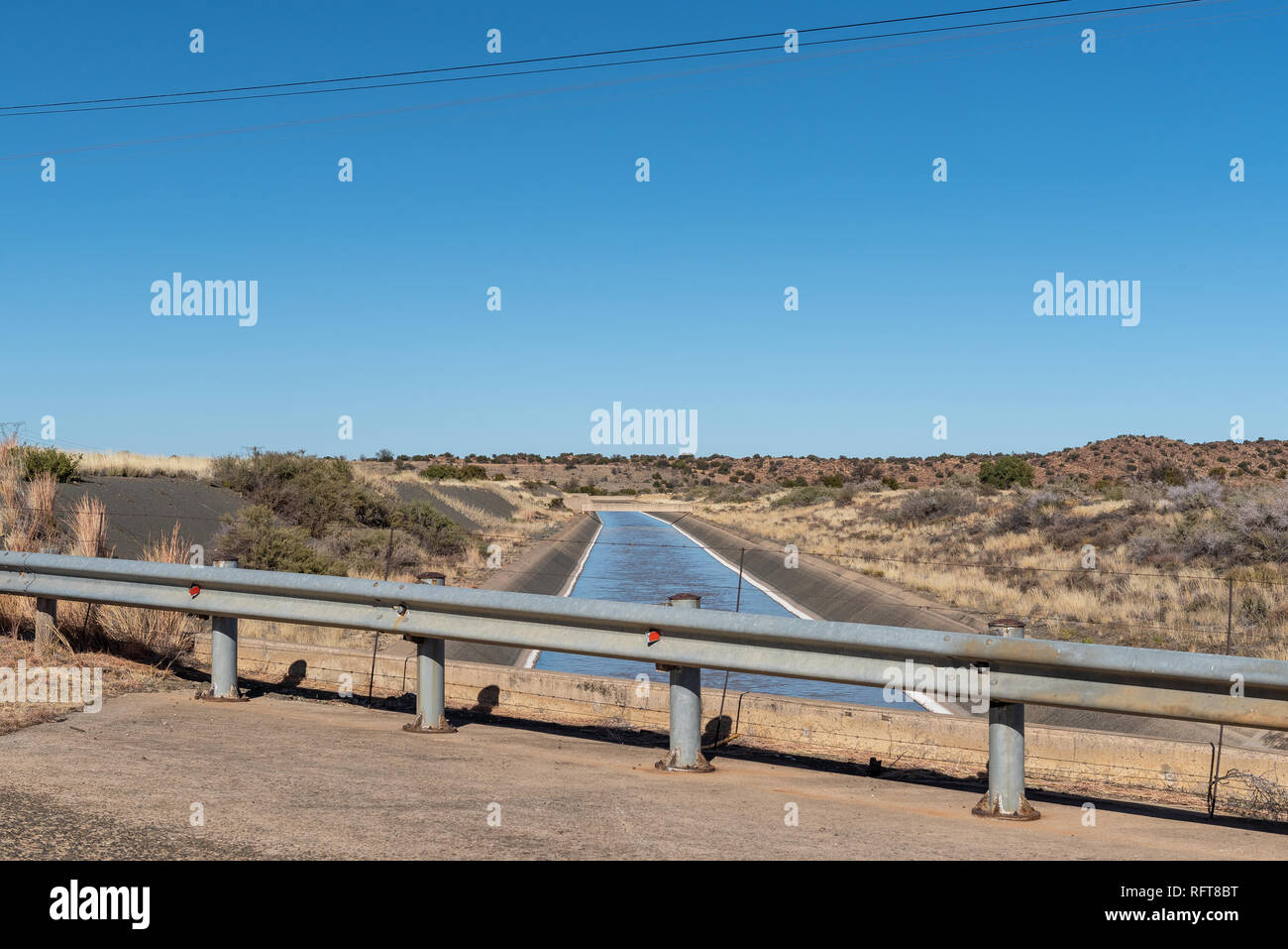 An irrigation canal, originating from the Vanderkloof Dam, near ...