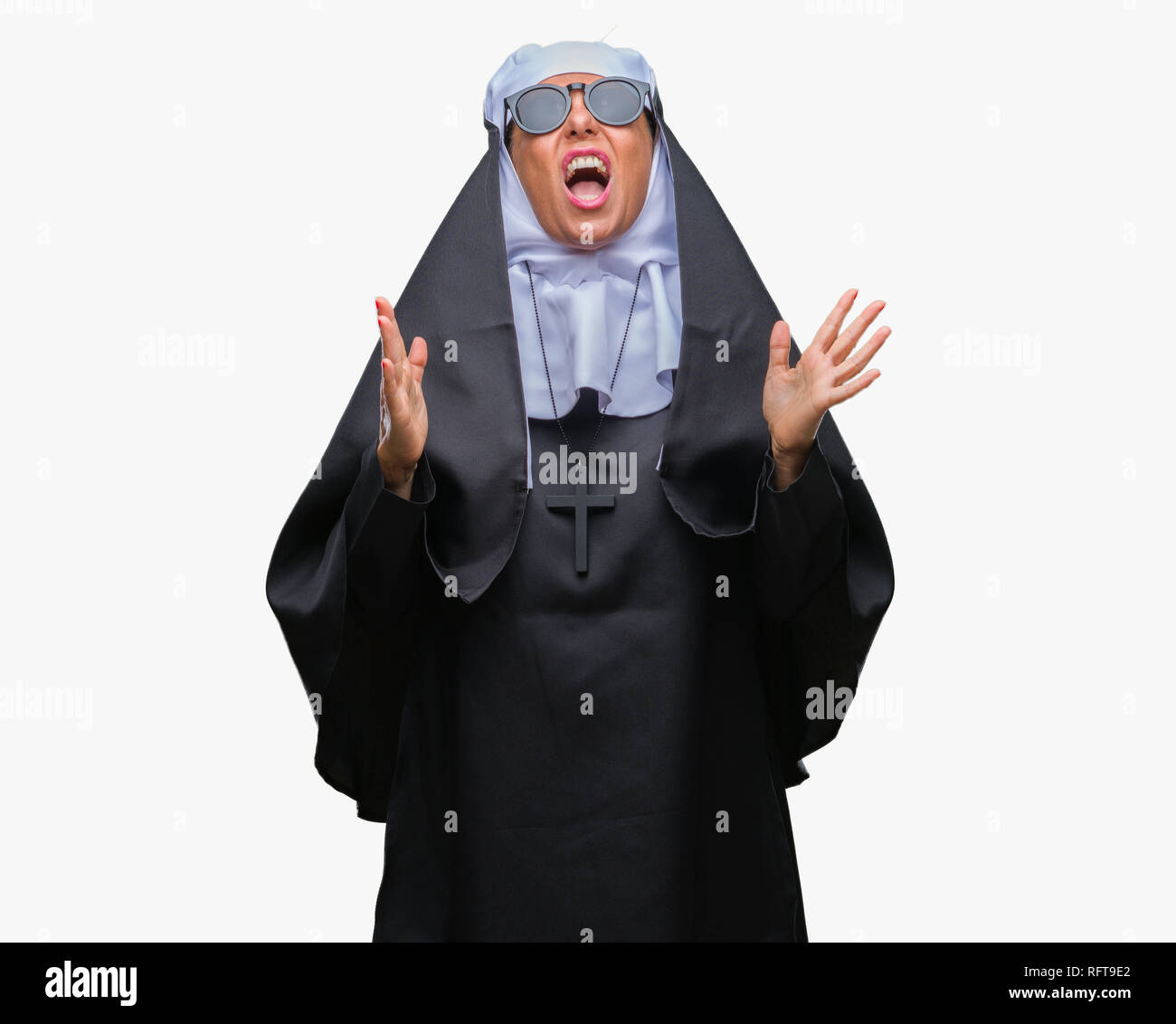 Middle age senior catholic nun woman wearing sunglasses over isolated ...
