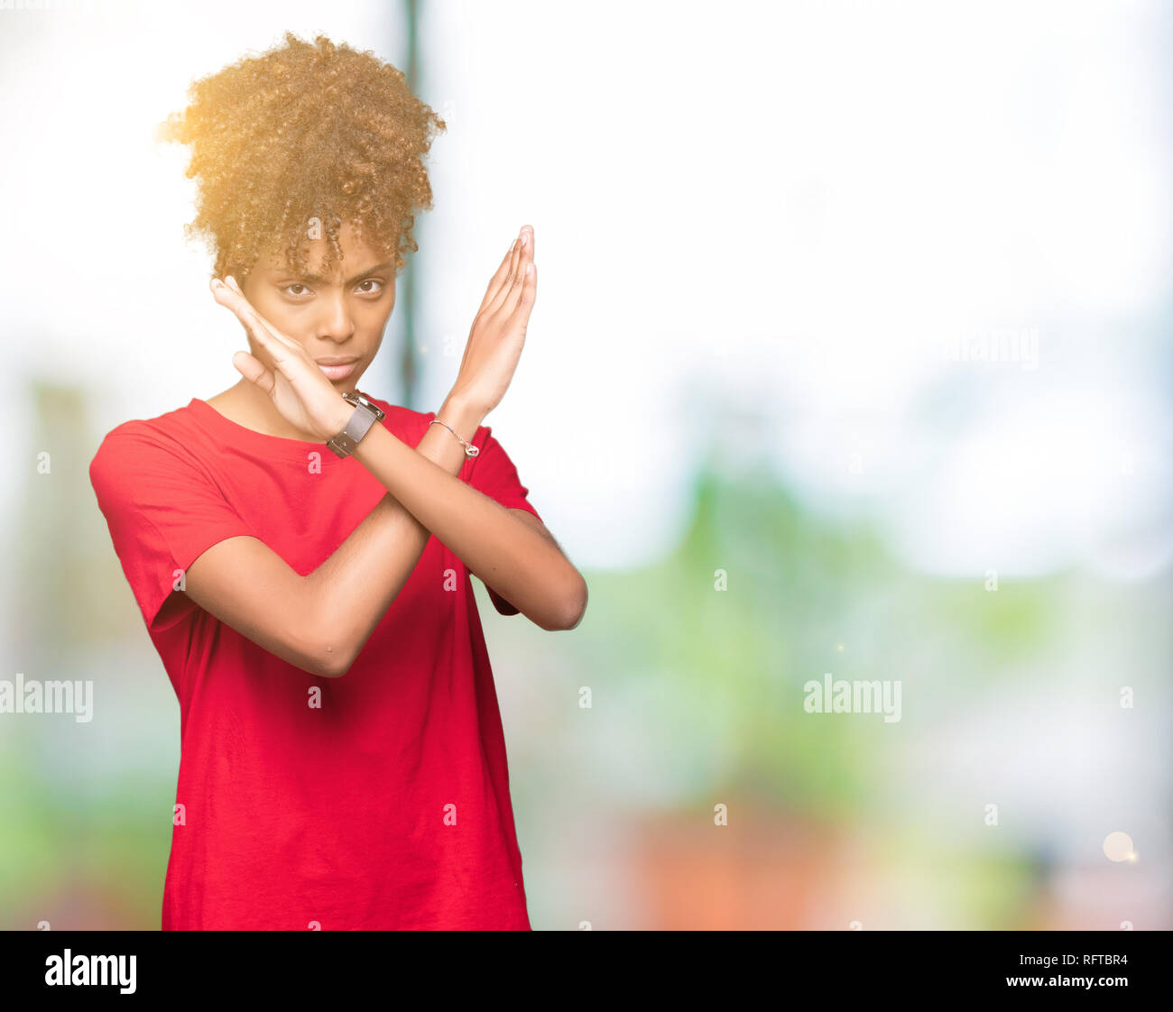Beautiful young african american woman over isolated background ...