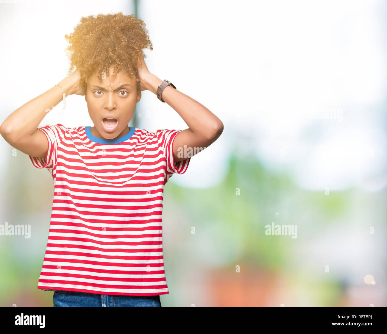 Beautiful young african american woman over isolated background Crazy ...