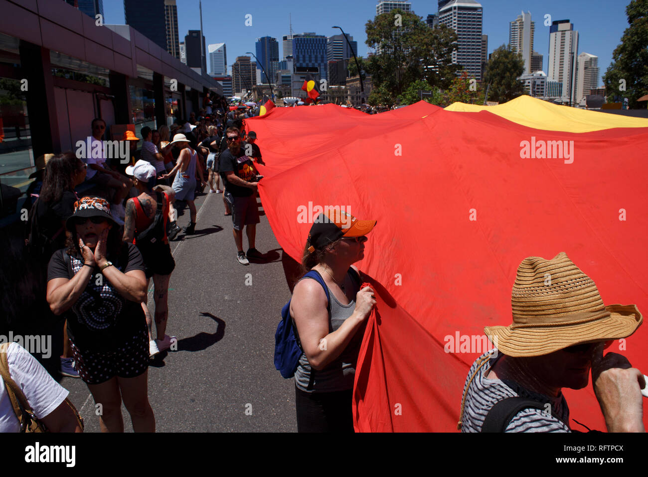 Over a dozen people carried the enormous Aboriginal flag for the ...