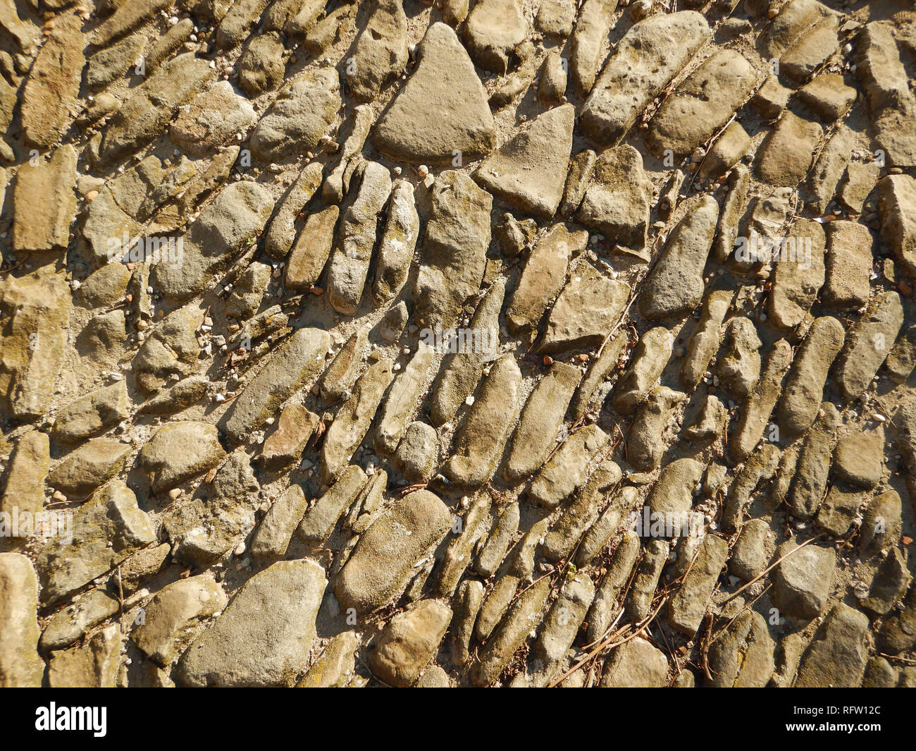 Background - A medieval road made with stones Stock Photo - Alamy
