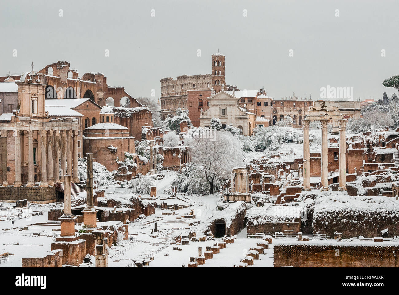 Winter in Rome. Snow falling on Roman Forum ancient ruins Stock Photo ...