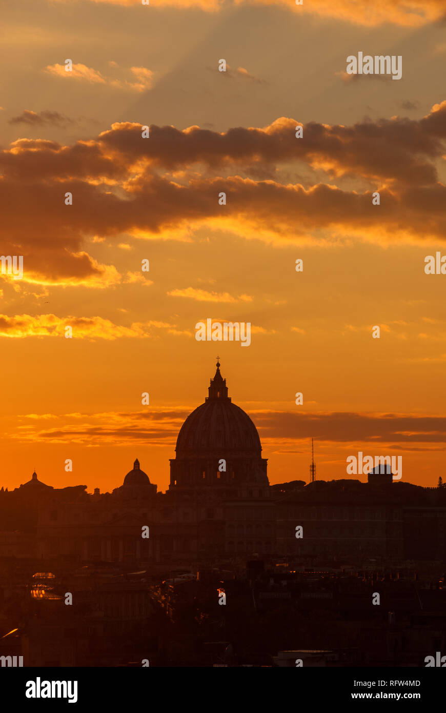 View of Rome historic center sunset skyline with ancient St Peter dome ...