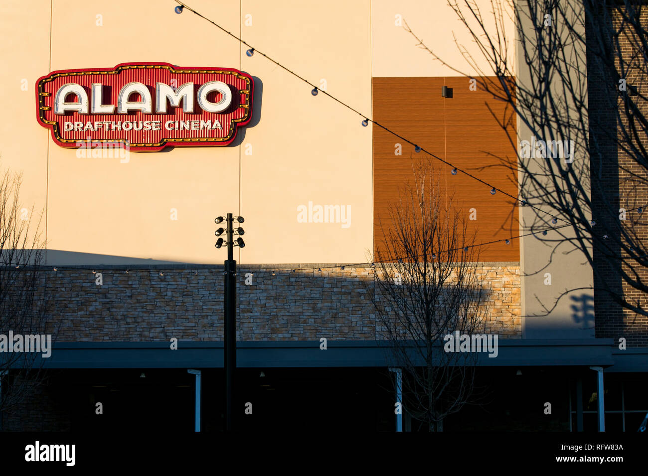 A logo sign outside of an Alamo Drafthouse Cinema location in ...