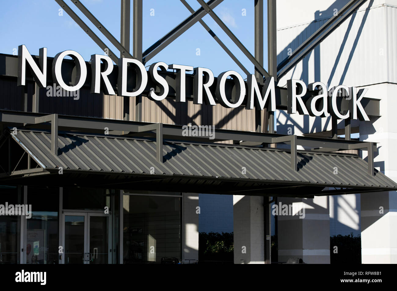 A logo sign outside of a Nordstrom Rack retail store location in ...
