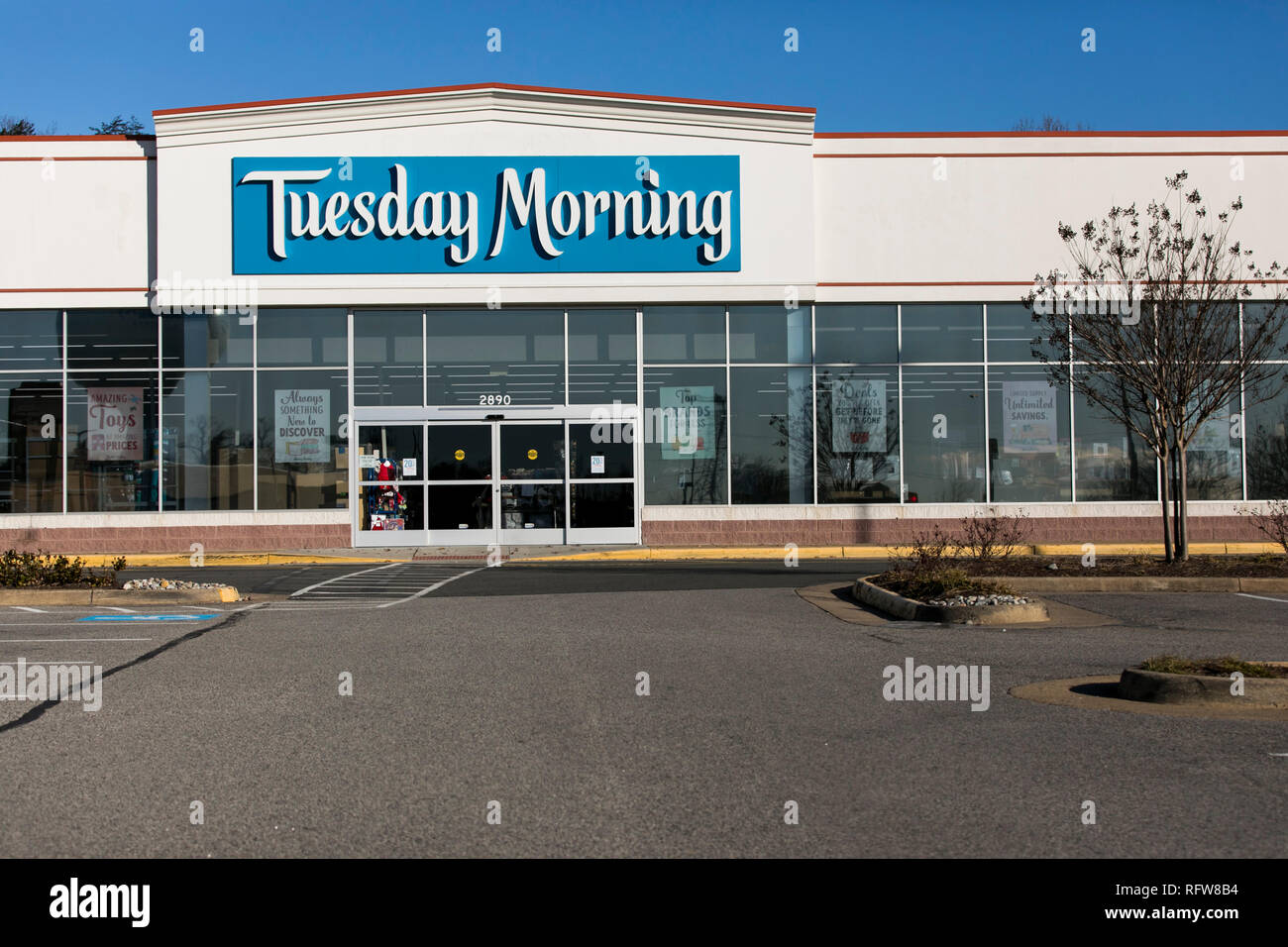 A logo sign outside of a Tuesday Morning retail store location in ...