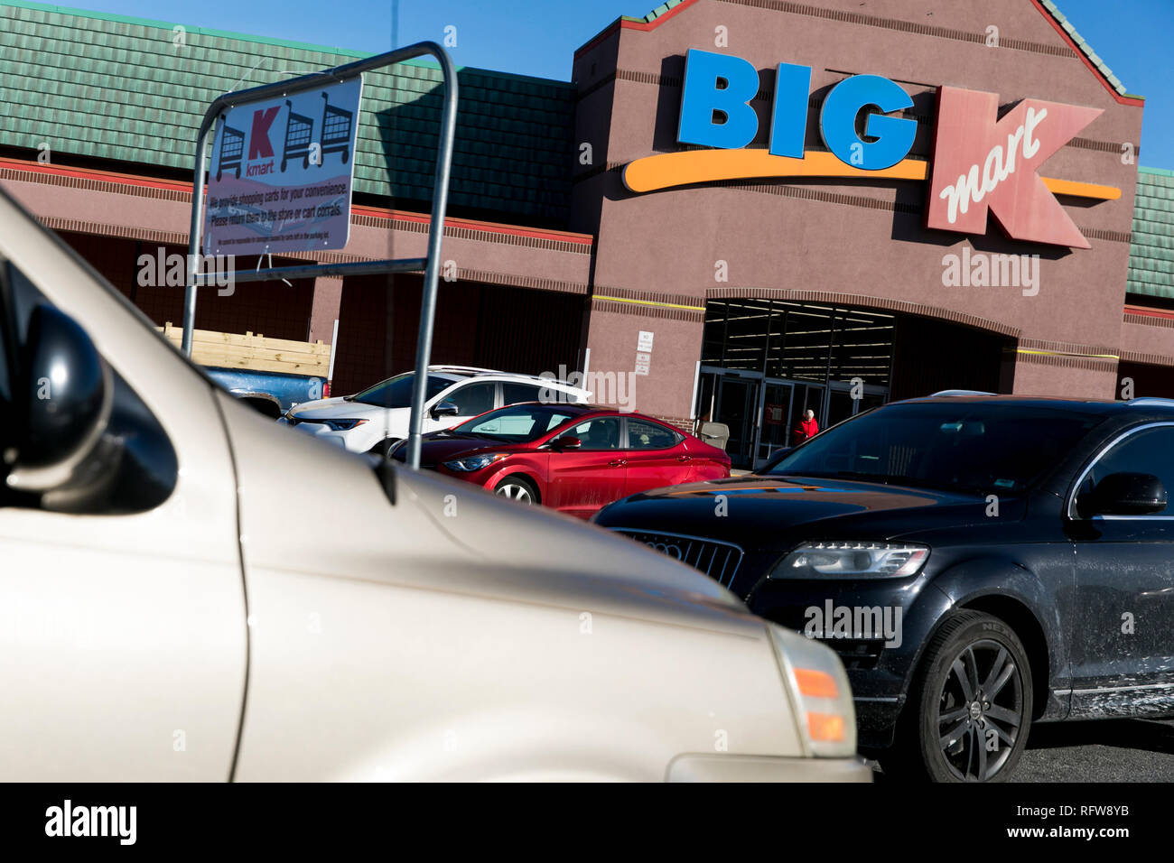 A logo sign outside of a Big Kmart retail store location in Frederick ...