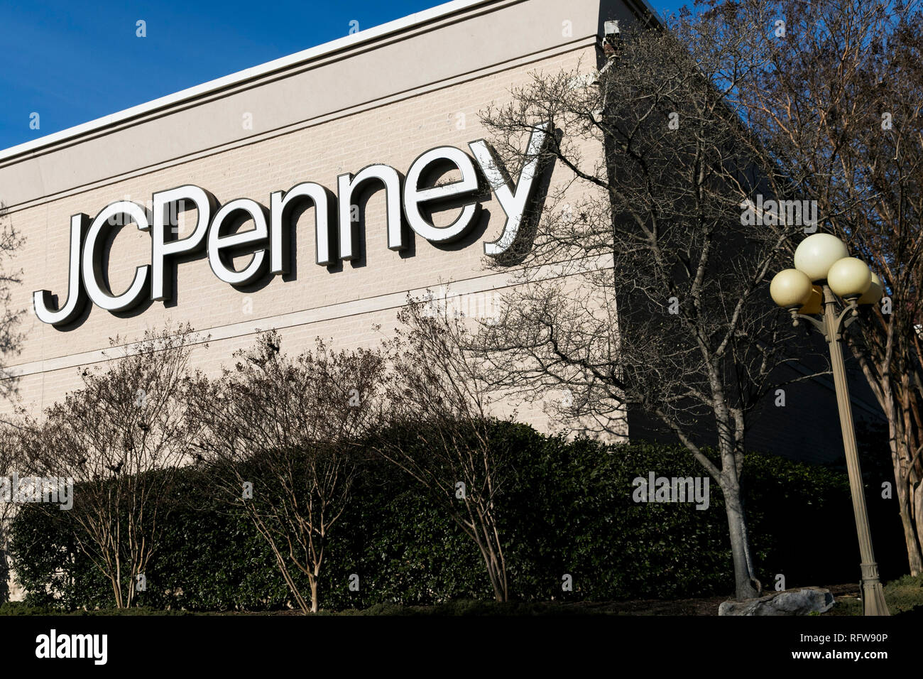 A logo sign outside of a JCPenney retail store location in Frederick ...
