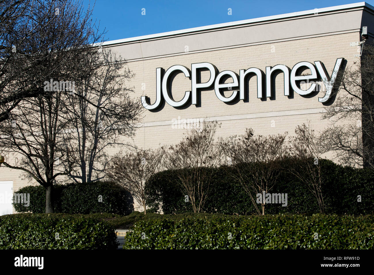 A logo sign outside of a JCPenney retail store location in Frederick ...