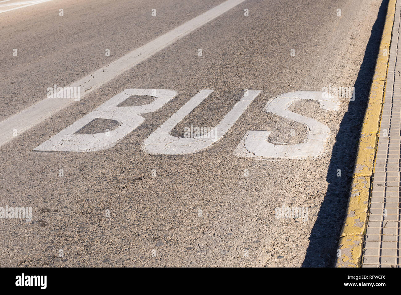 Yellow Bus Stop Sign Painted High Resolution Stock Photography and ...