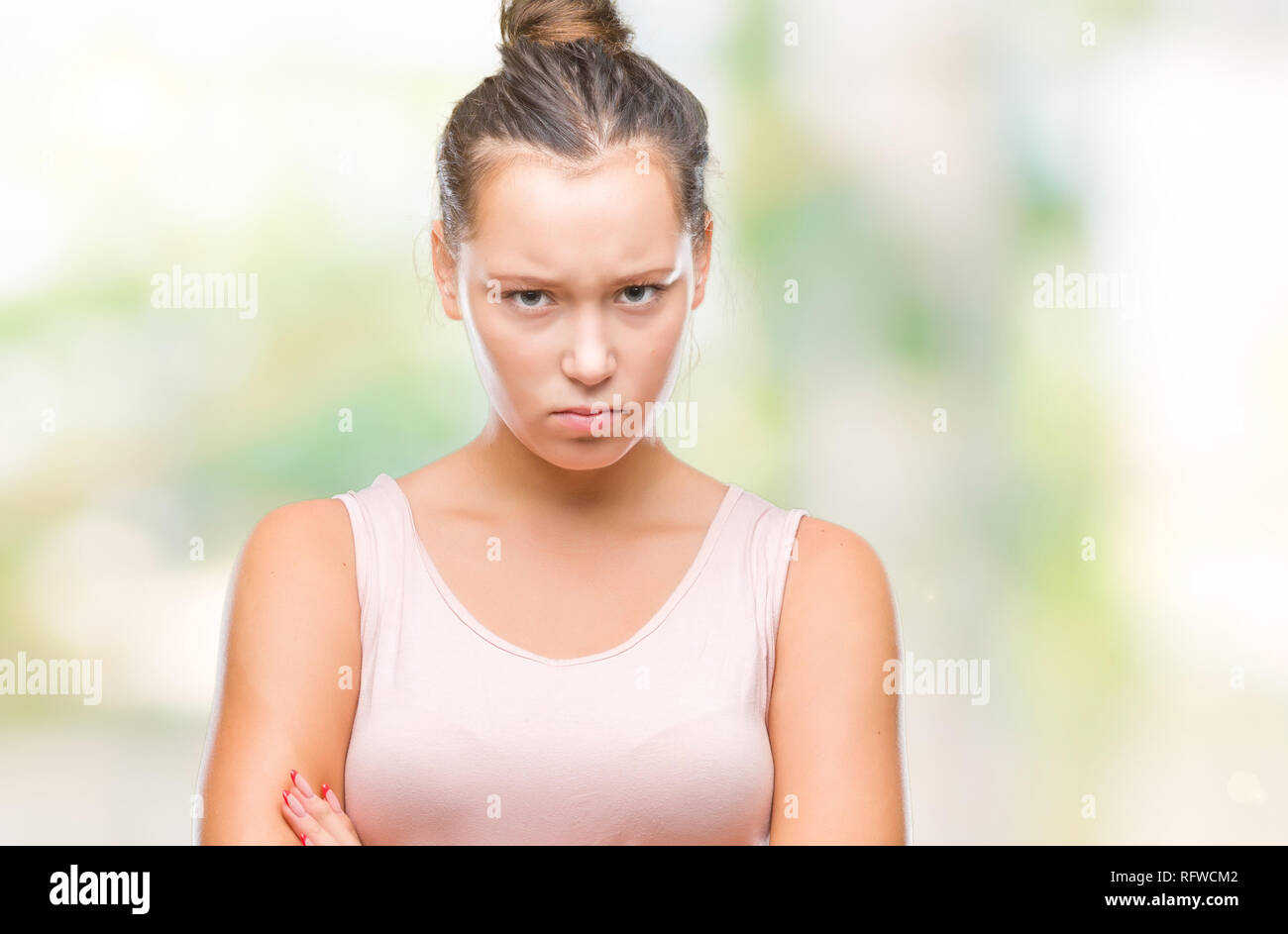 Young caucasian beautiful woman over isolated background skeptic and ...