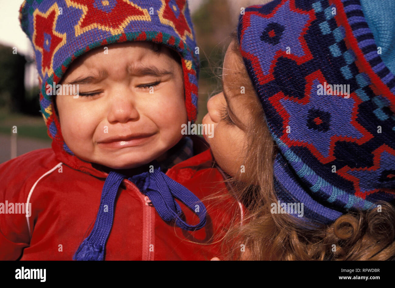 little girl consoling her crying sister Stock Photo - Alamy
