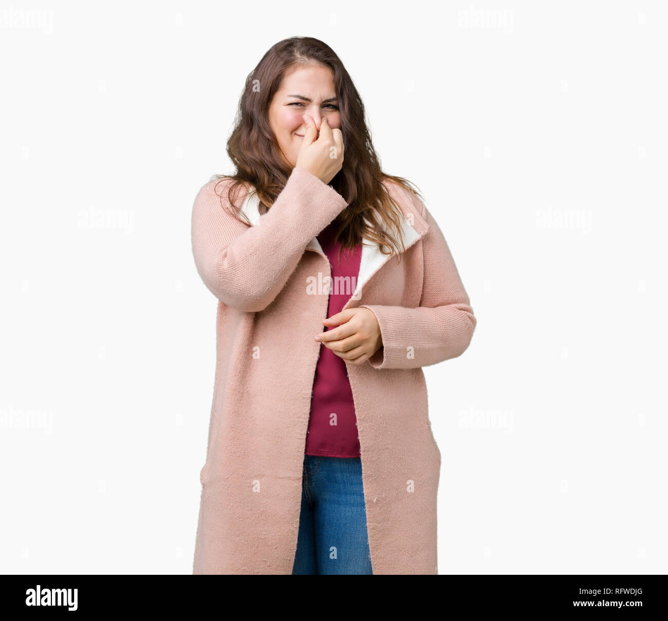 Beautiful plus size young woman wearing winter coat over isolated ...