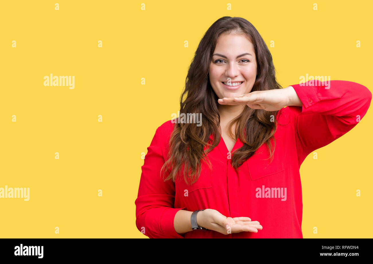 Beautiful plus size young business woman over isolated background ...